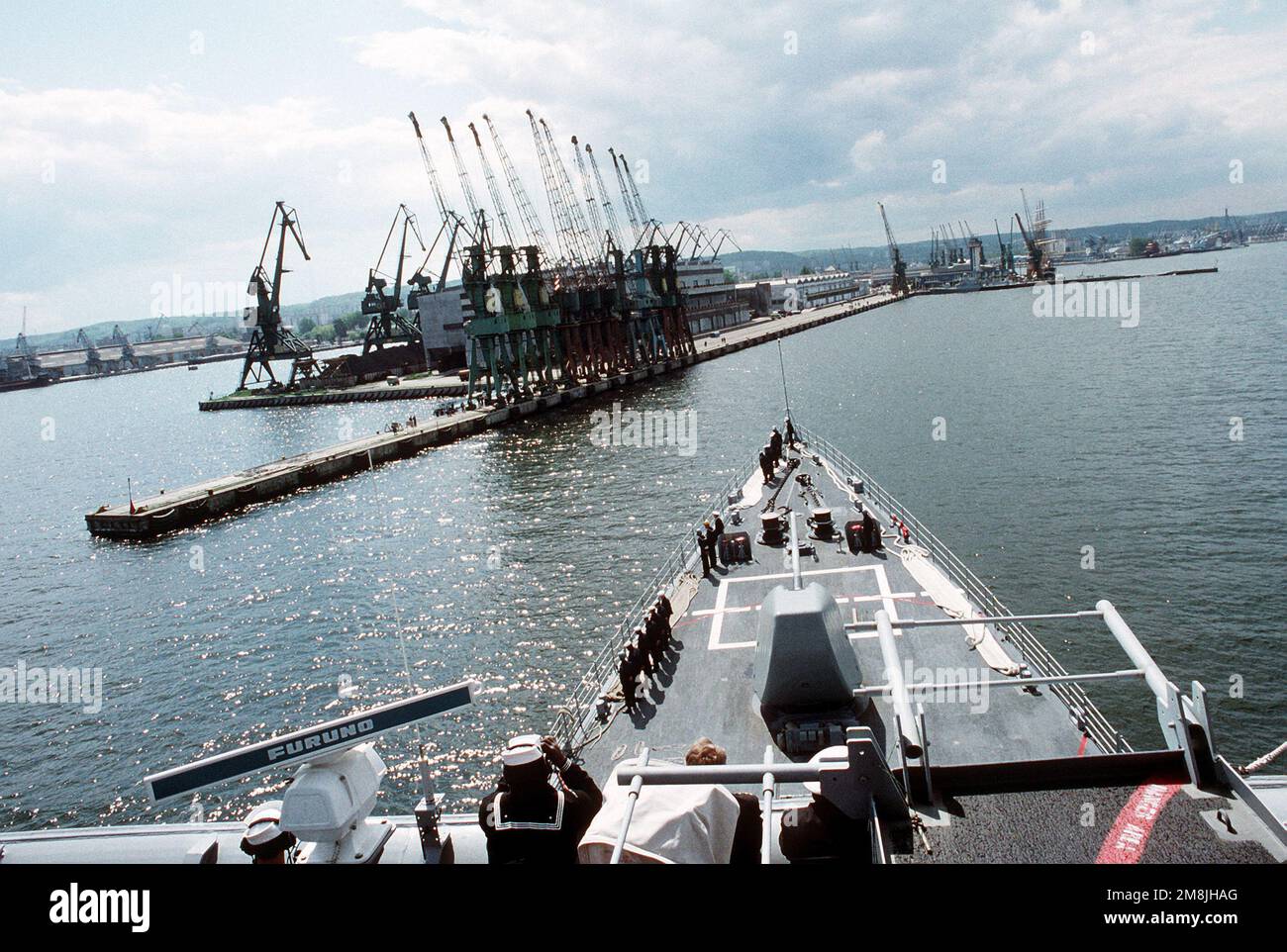 The destroyer USS HAYLER (DD-997) makes the final approach to a pier ...