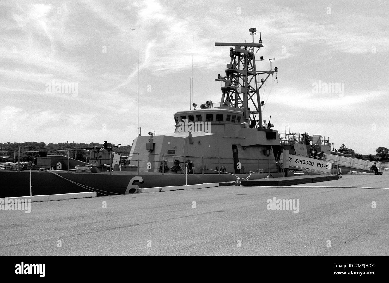 A port bow view of the coastal patrol boat USS SIROCCO (PC-6) tied up ...