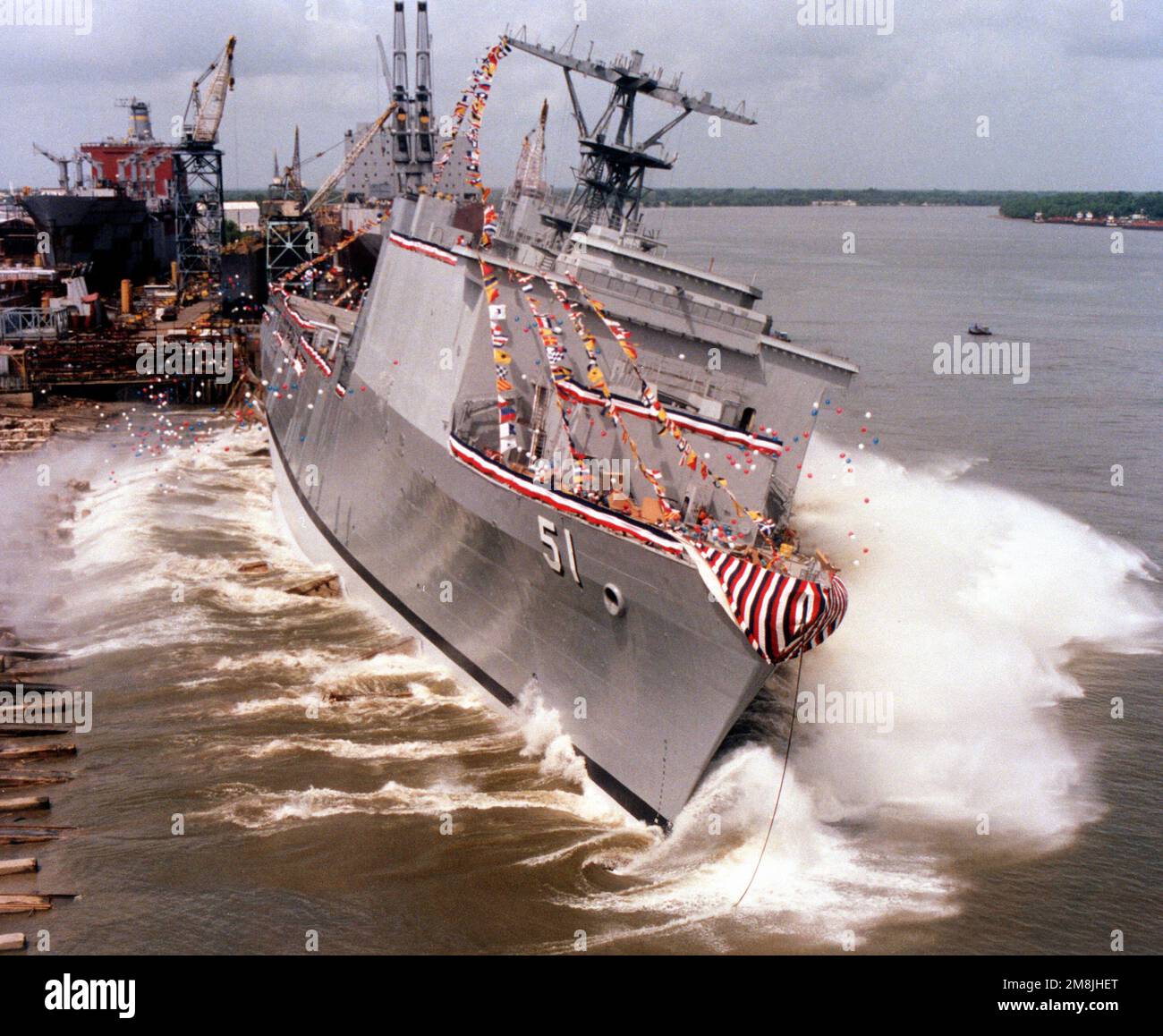 With a surge of white water, the dock landing ship OAK HILL (LSD-51 ...
