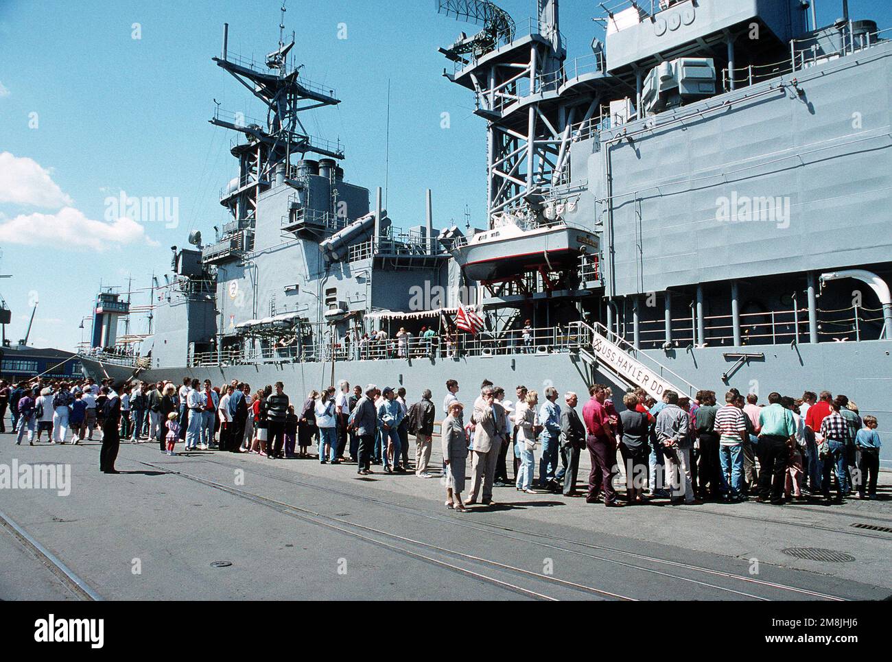 Crowds of Polish citizens including many families with children line up ...
