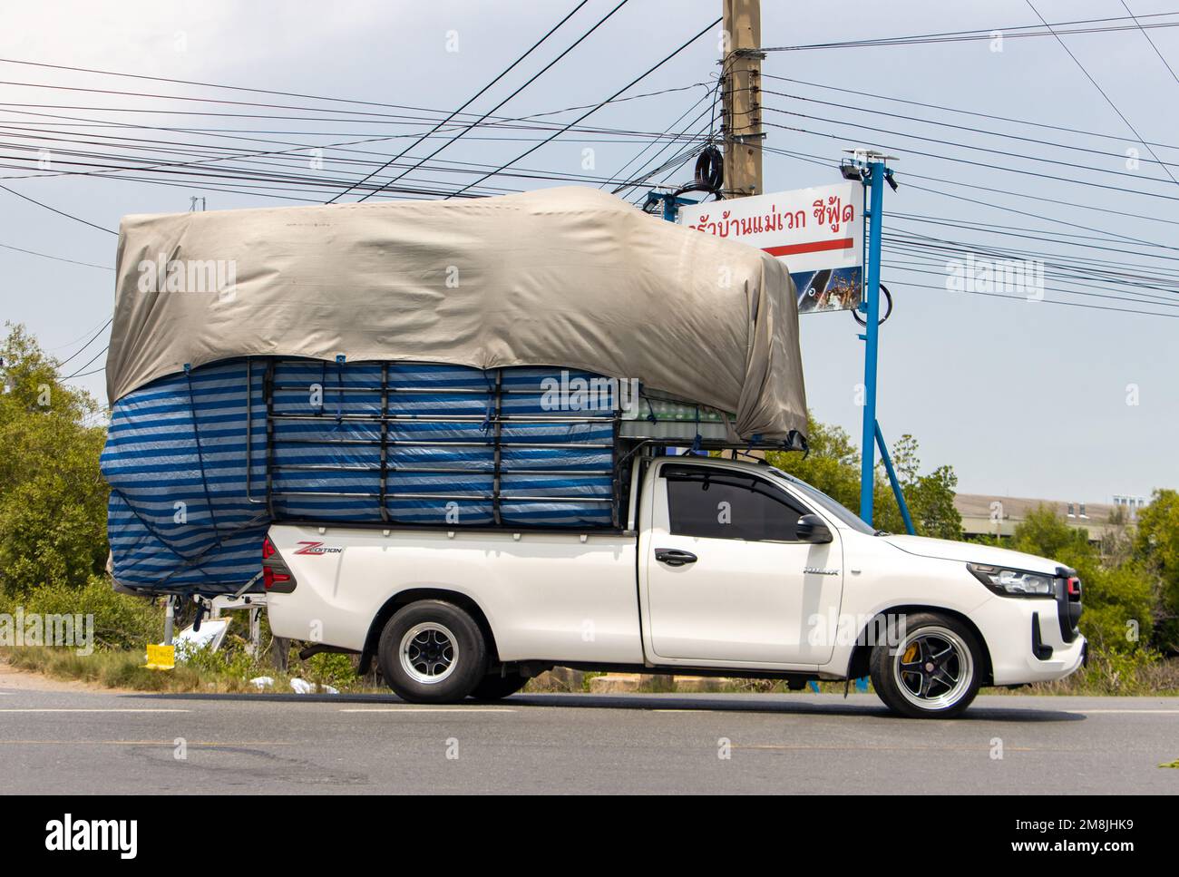 BANGKOK, THAILAND, JUNE 01 2022, A pick-up fully loaded with drinking ...