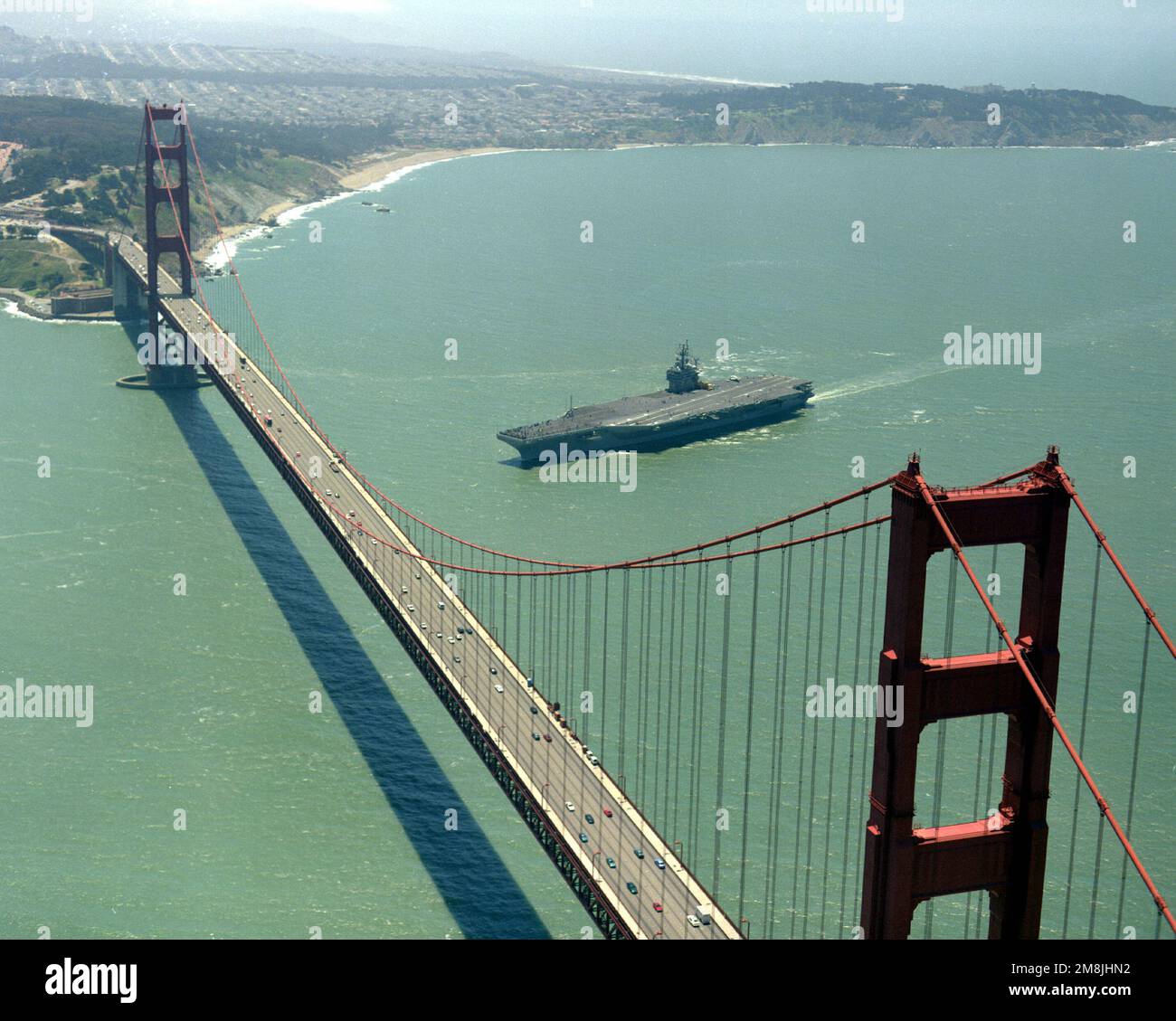 An aerial port bow view of the nuclear-powered aircraft carrier USS ...