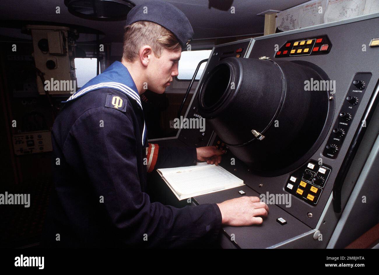 A Russian sailor monitors a navigational radar screen on board the ...