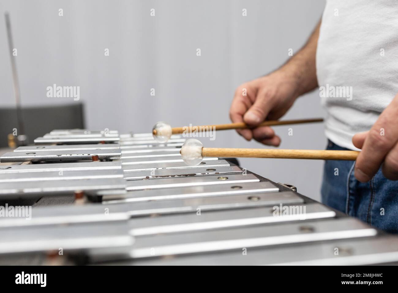 A close-up shot of a person playing on a xylophone Stock Photo - Alamy