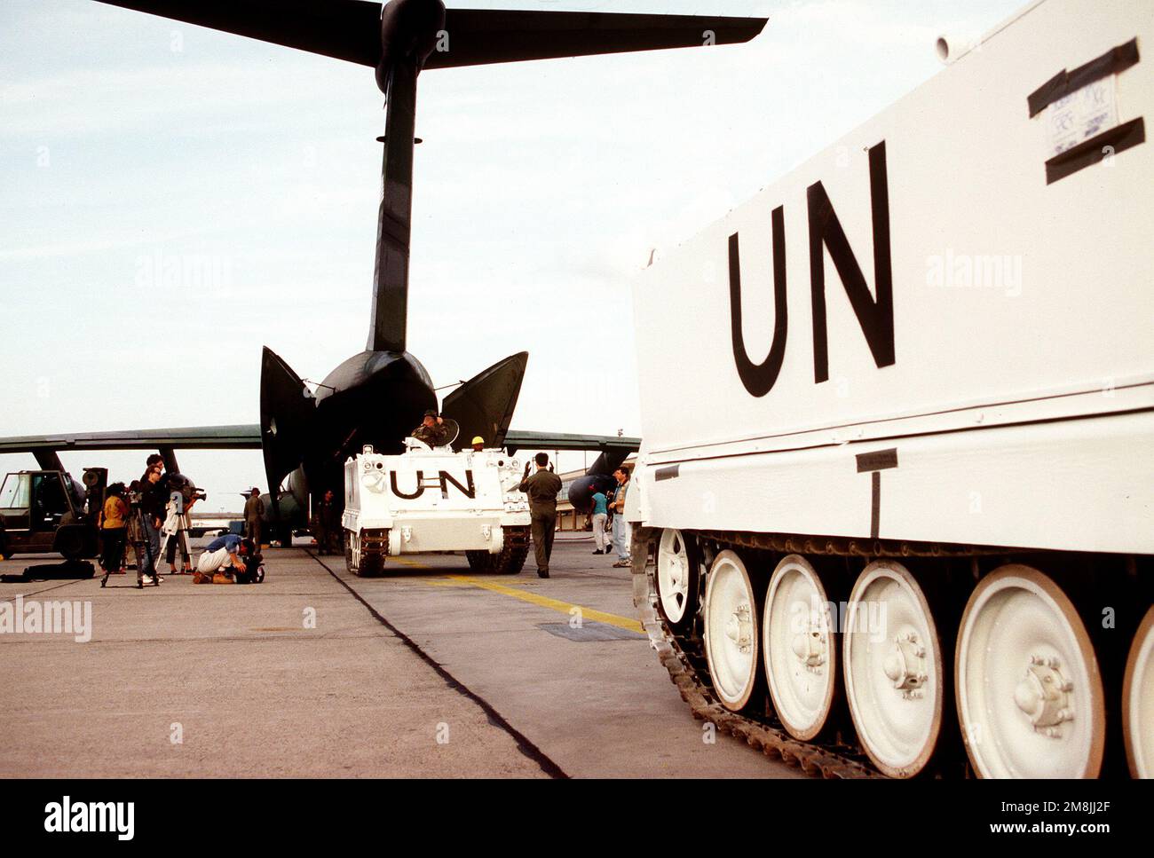 Two M113 armored personnel carriers are lined up before being loaded ...