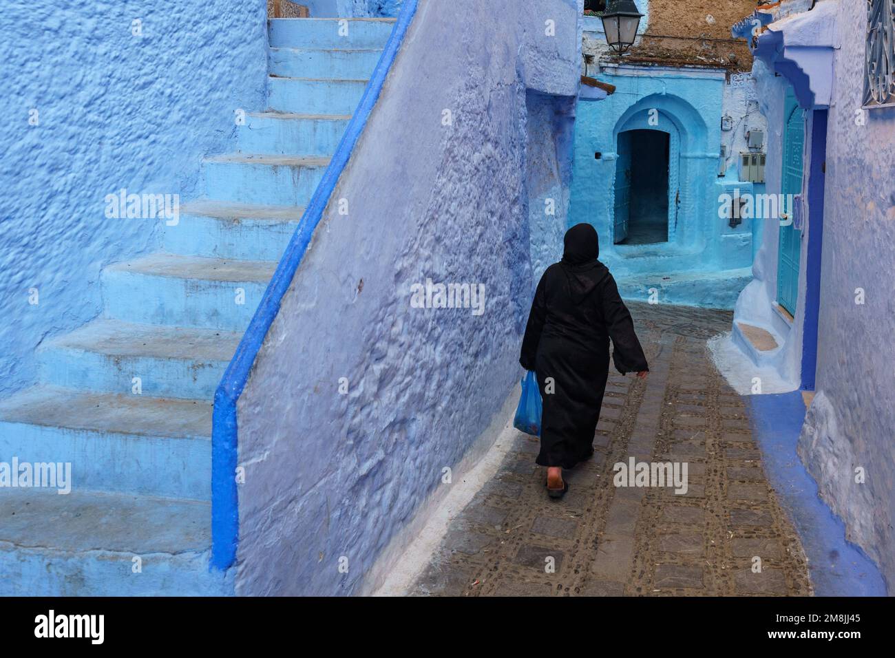 North Africa. Morocco. Chefchaouen. A maghrebin woman dressed in ...