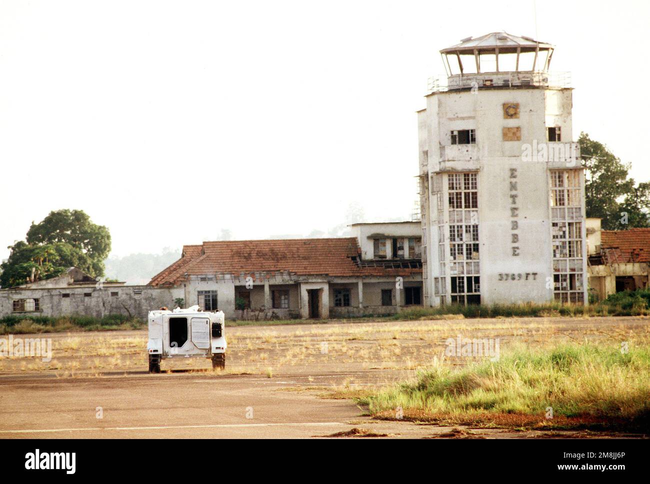 An M-113A2 rolls to a holding area after being unloaded from USAF C-141 ...