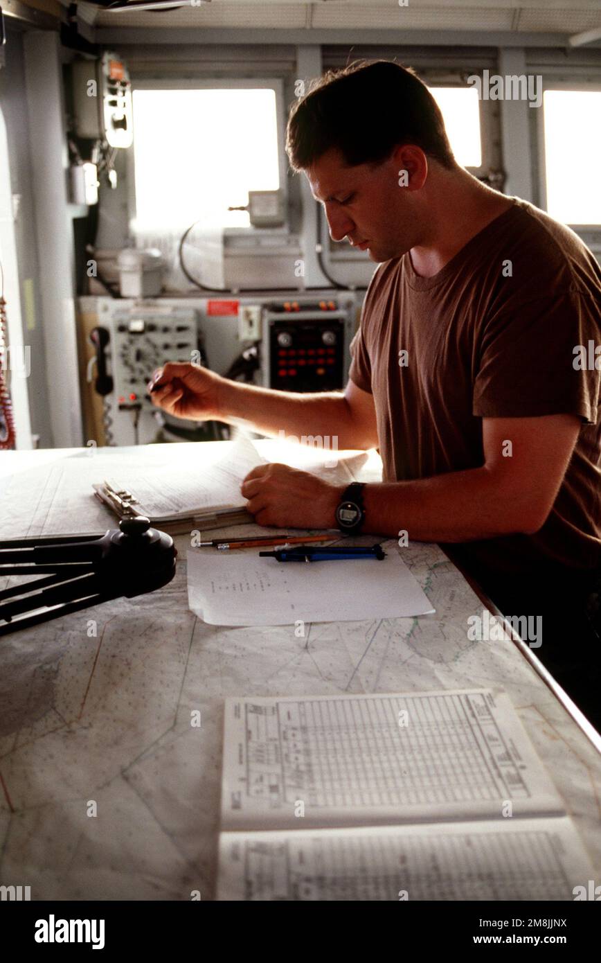 Quartermaster Second Class (QM2) Shannon Stuehm on the bridge of the ...