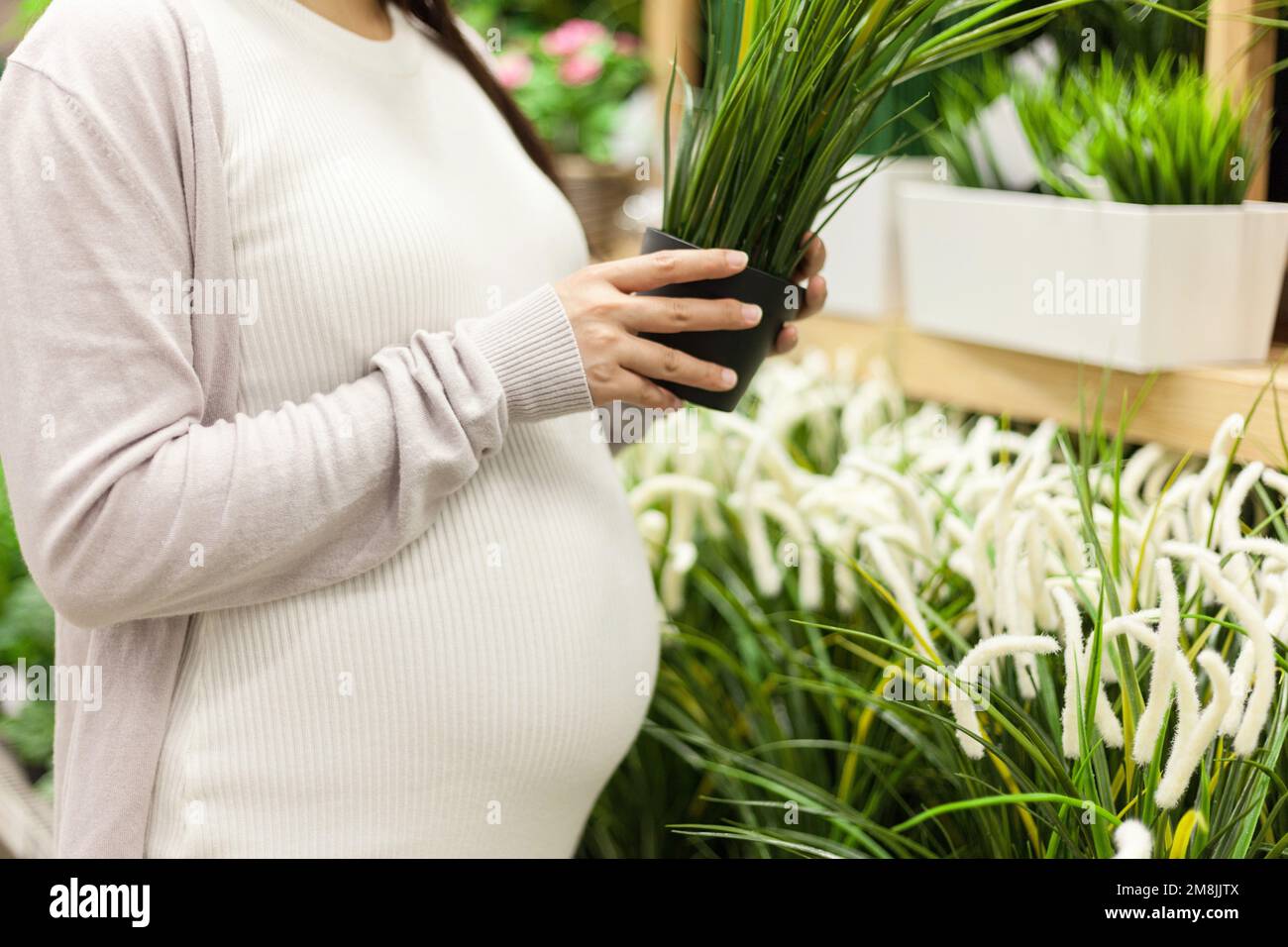 Pregnant mother gardening hi-res stock photography and images - Alamy