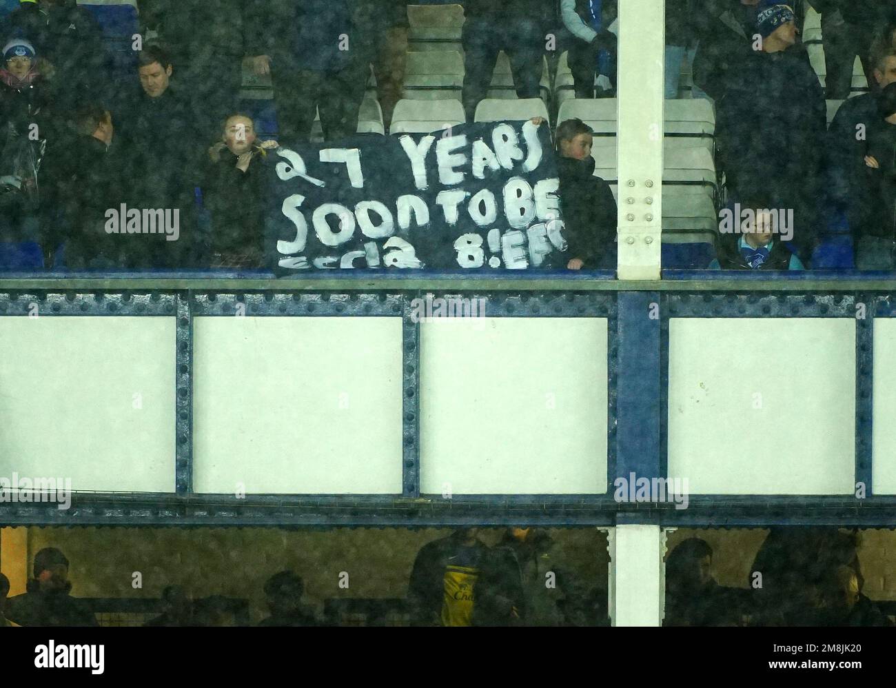 Everton fans hold up banners in protest against the clubs board after ...