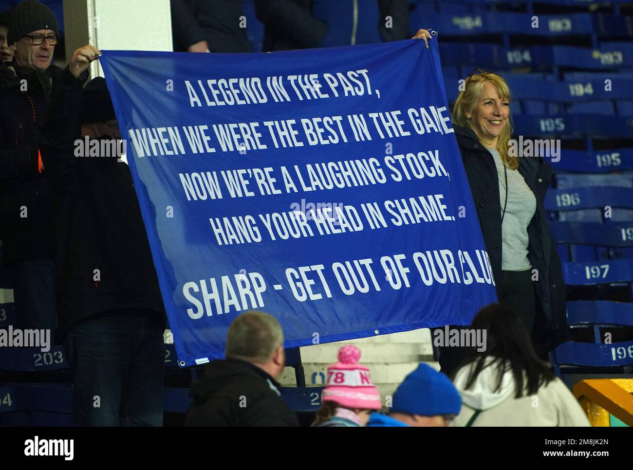 Everton fans hold up banners in protest against the clubs board after ...