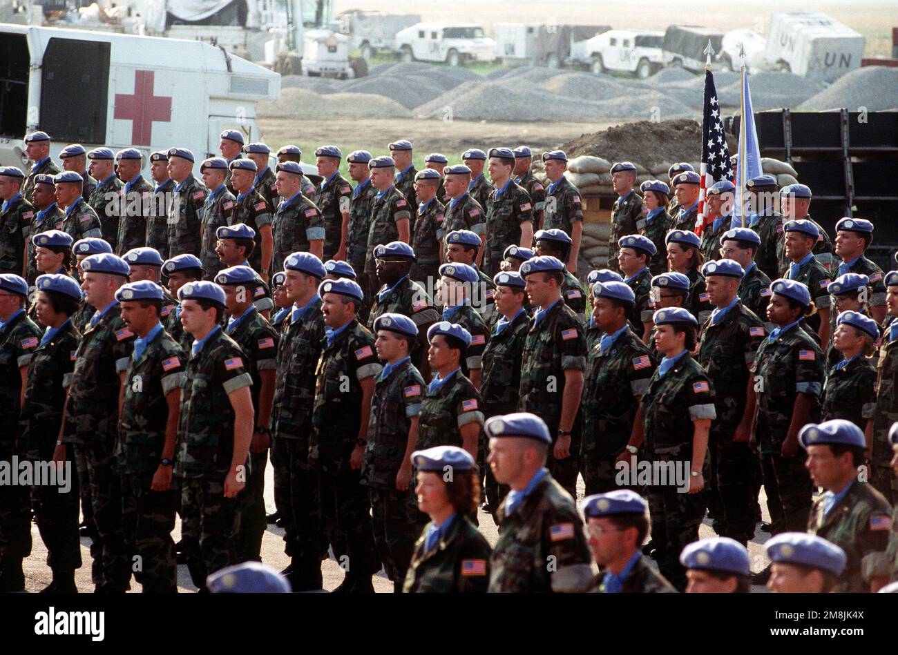 A left side view of the troops at attention as The Colors are presented ...