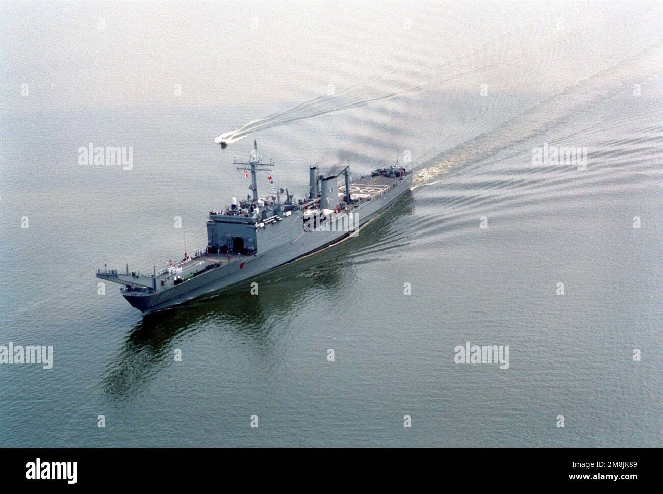 An aerial port bow view of the tank landing ship USS FAIRFAX COUNTY ...