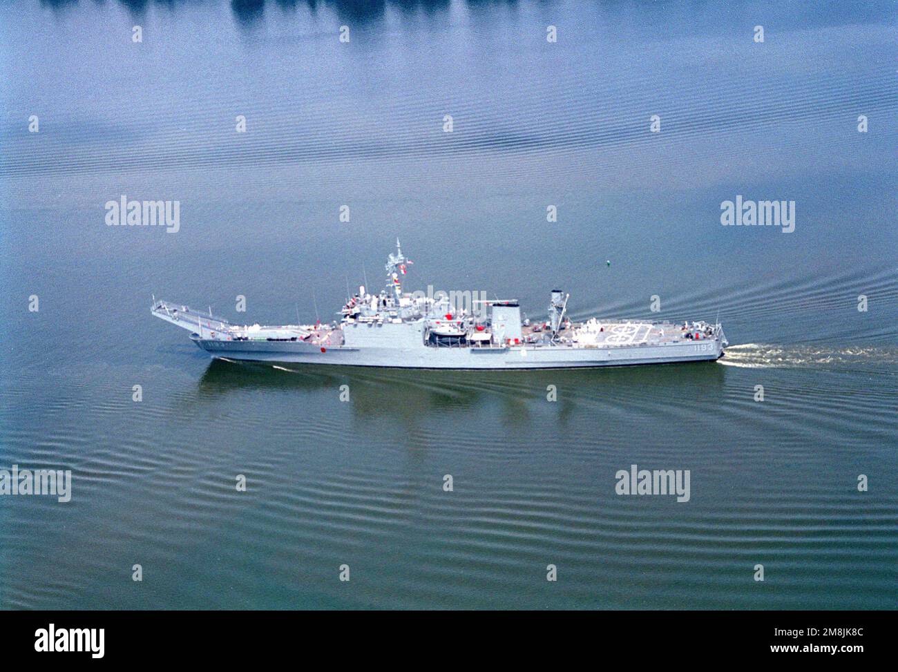 An aerial port side view of the tank landing ship USS FAIRFAX COUNTY ...