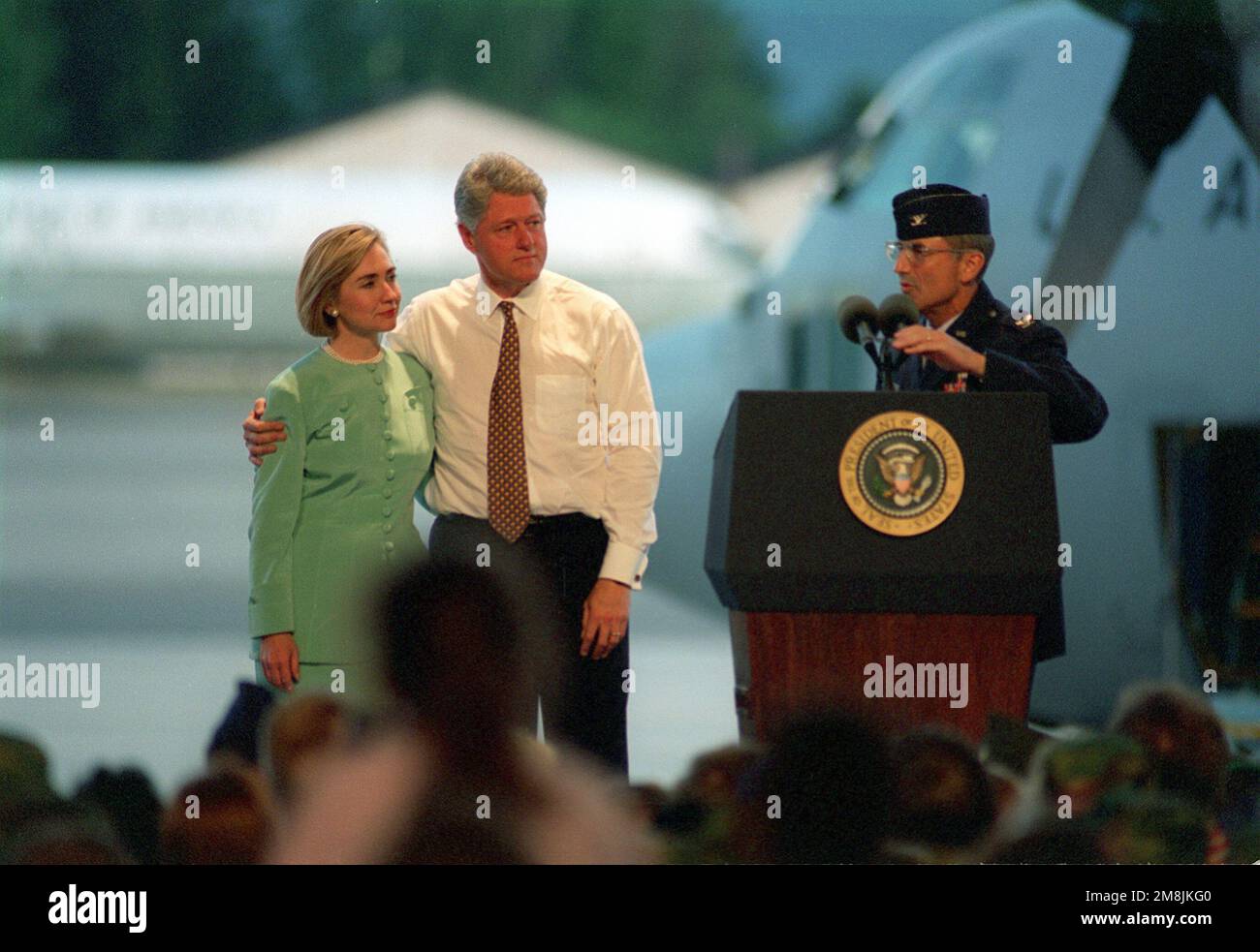 COL. Caine, 86th Wing Commander, stands behind the podium facing ...