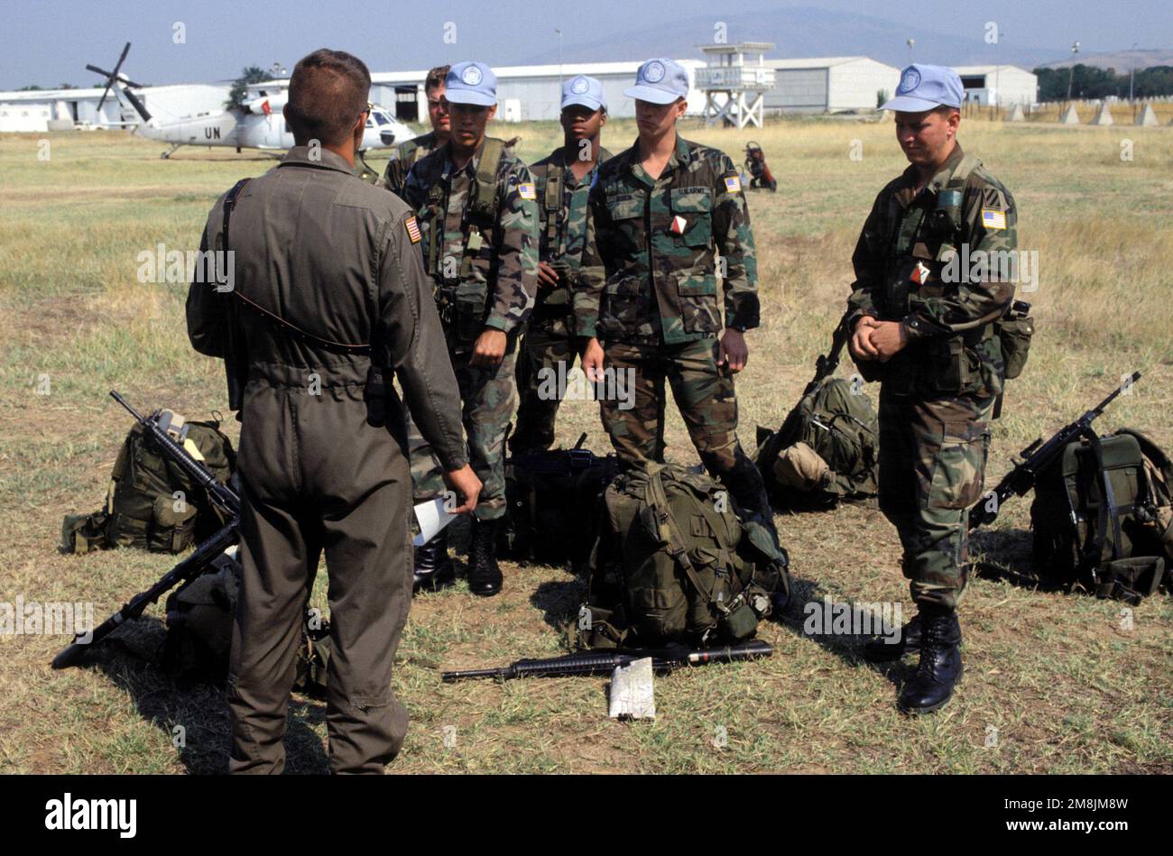 US Army scouts from the 2nd Battalion, 15th Infantry are briefed on ...