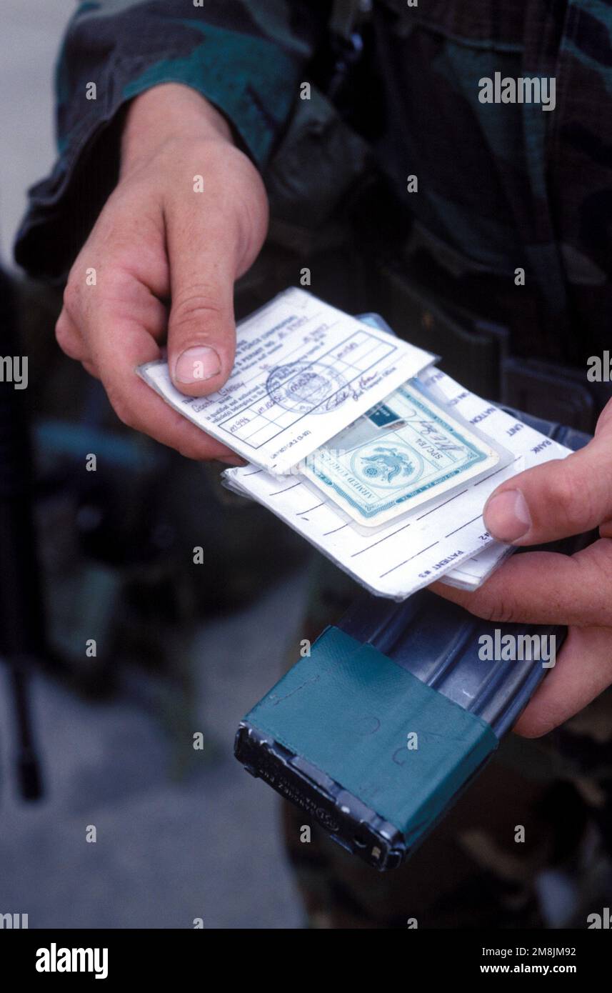 The soldiers identification cards are inspected before they depart from ...