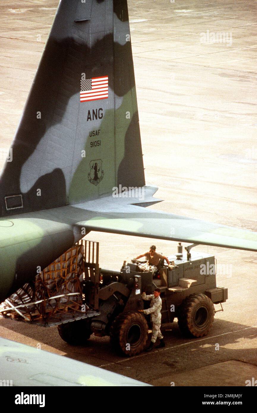 An overhead left rear view of a camouflaged C-130 from the Air National ...