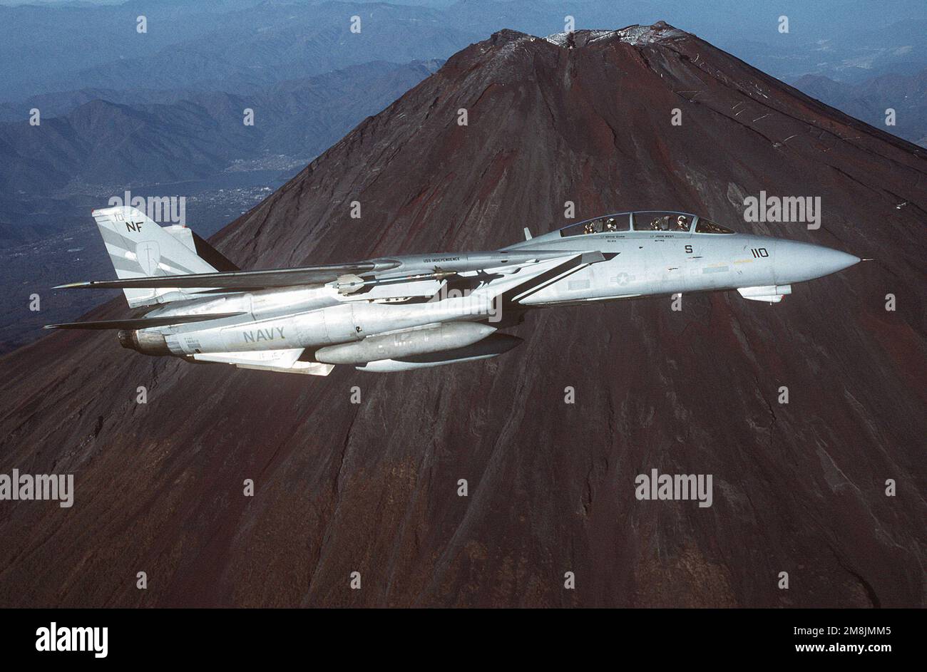 An F-14A Tomcat aircraft of Fighter Squadron 154 (VF-154) flies near ...