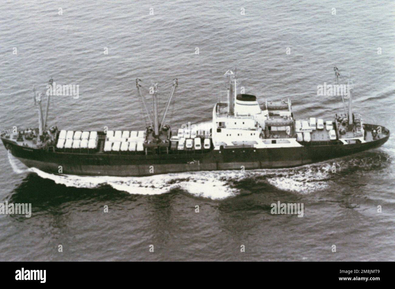 Port side view of the Russian timber carrier BARVARA, with a deck load ...