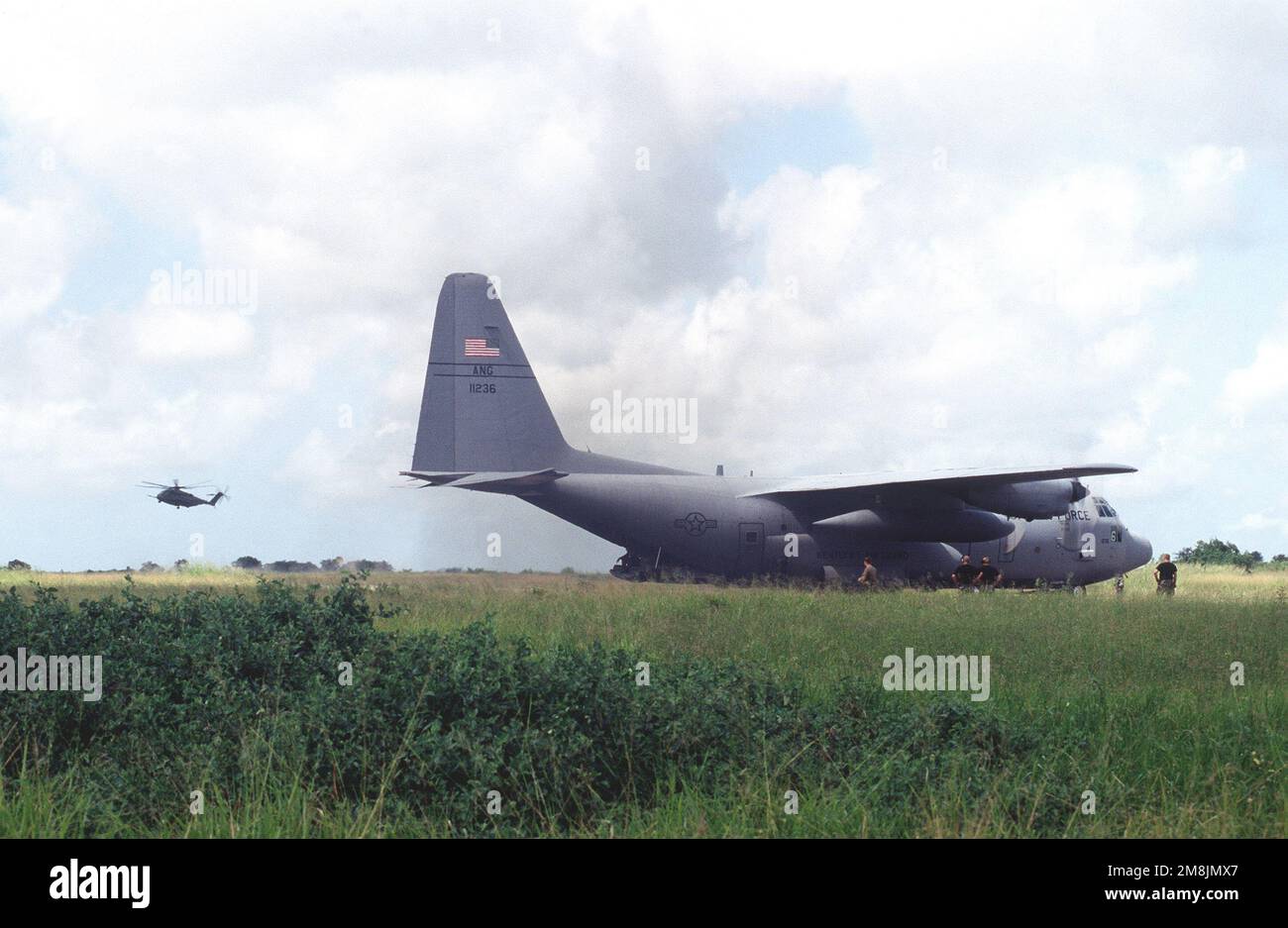 An Air National Guard 136th Air Wing C-130 Hercules transport from ...