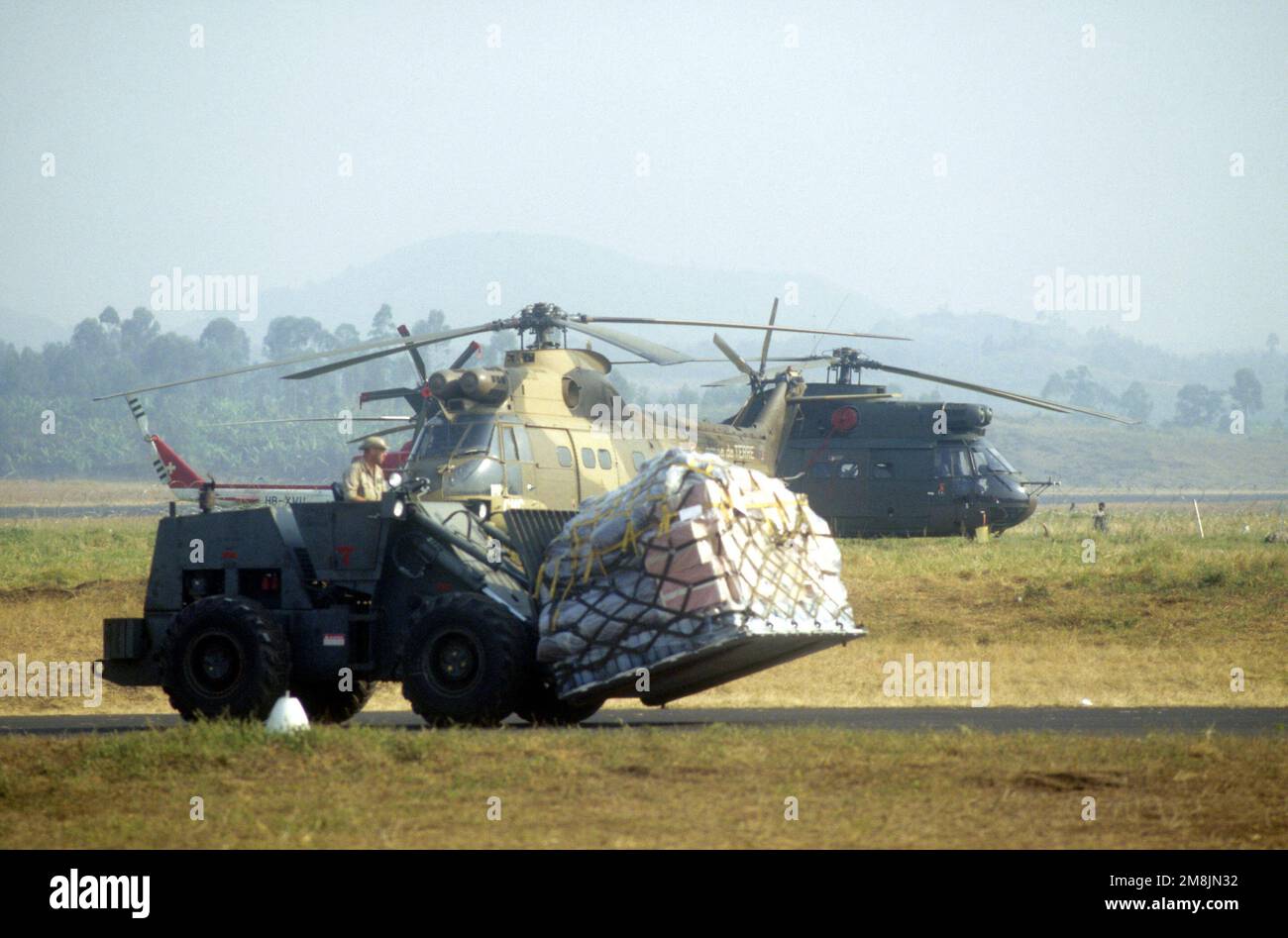 A member of the 314th Tactical Airlift Control Element (TALCE) uses a ...