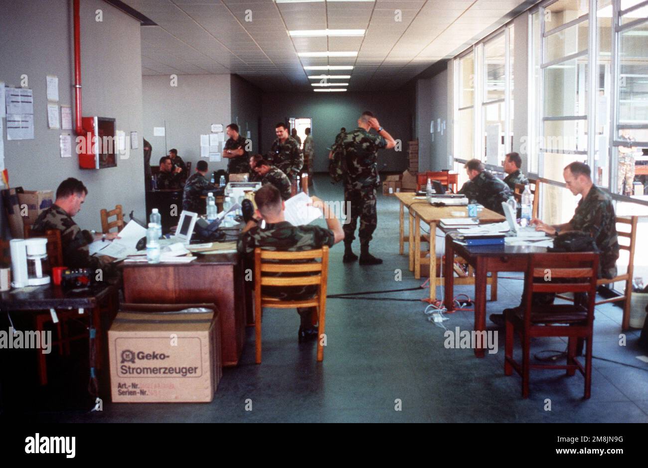 Members of the Joint Task Force command section coordinate airlift from ...
