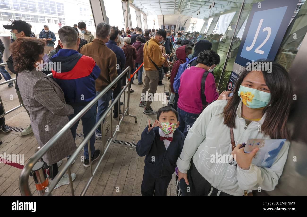 Connie Lam and her son George Lam lined up outside West Kowloon Station ...