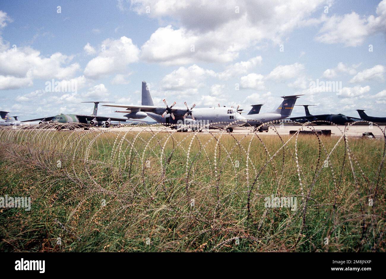 Barbed wire surrounds the flight line ramp at Moi International Airport ...
