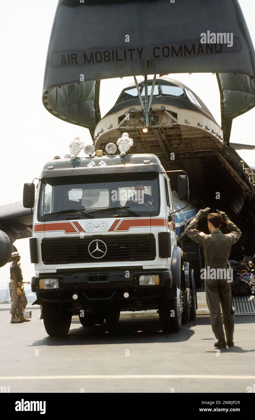 Commercial fuel truck is offloaded from a 9th Airlift Squadron, Dover ...