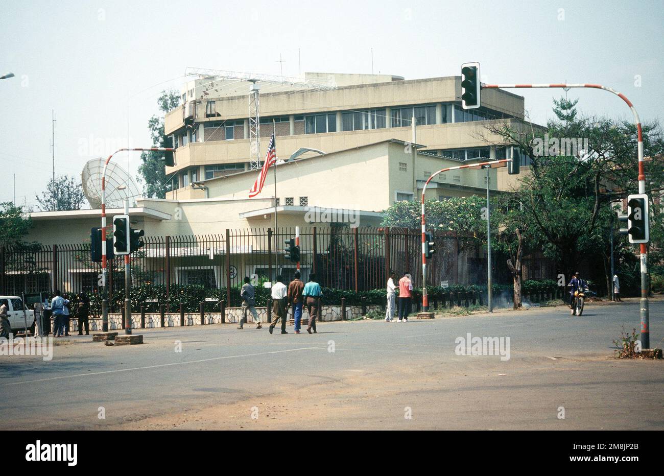 The Unites States Embassy along a city street in Kigali. Subject ...