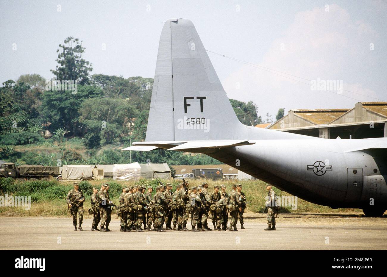 A group of U.S. Army soldiers are briefed on the flight line, at the ...