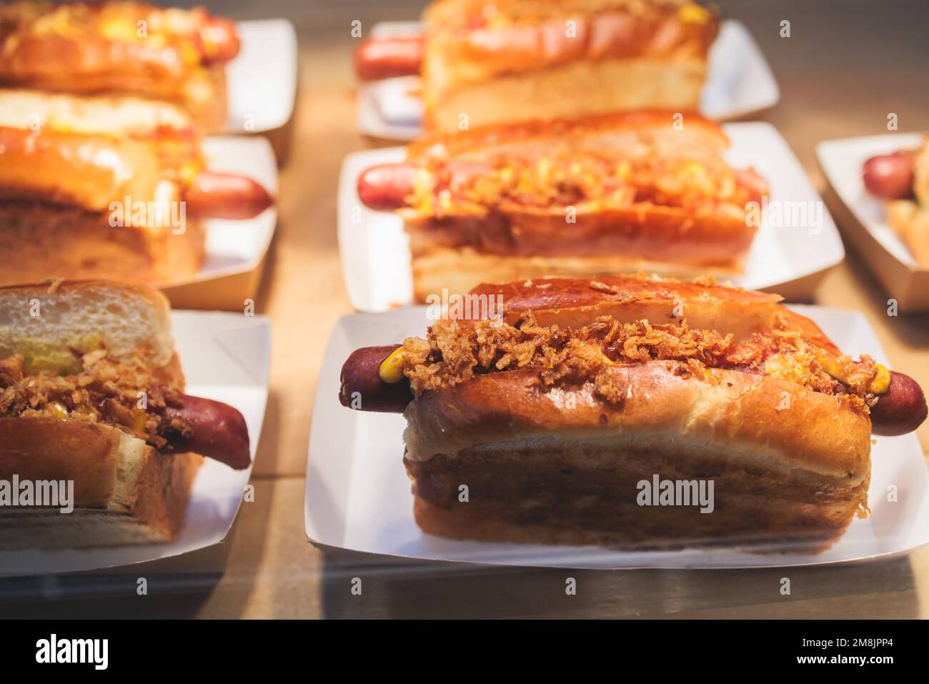Hot dogs snacks on a table, variety of different hot dog with a sausage ...