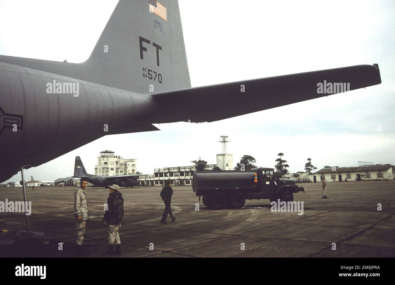C-130 Hercules aircraft upload operations on the flight line ramp of ...