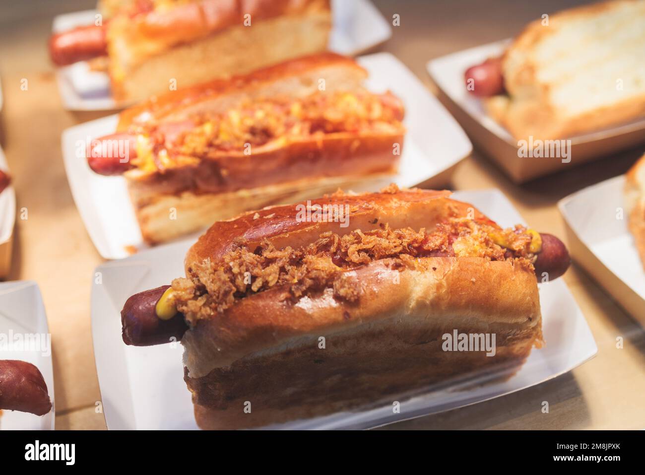 Hot dogs snacks on a table, variety of different hot dog with a sausage ...