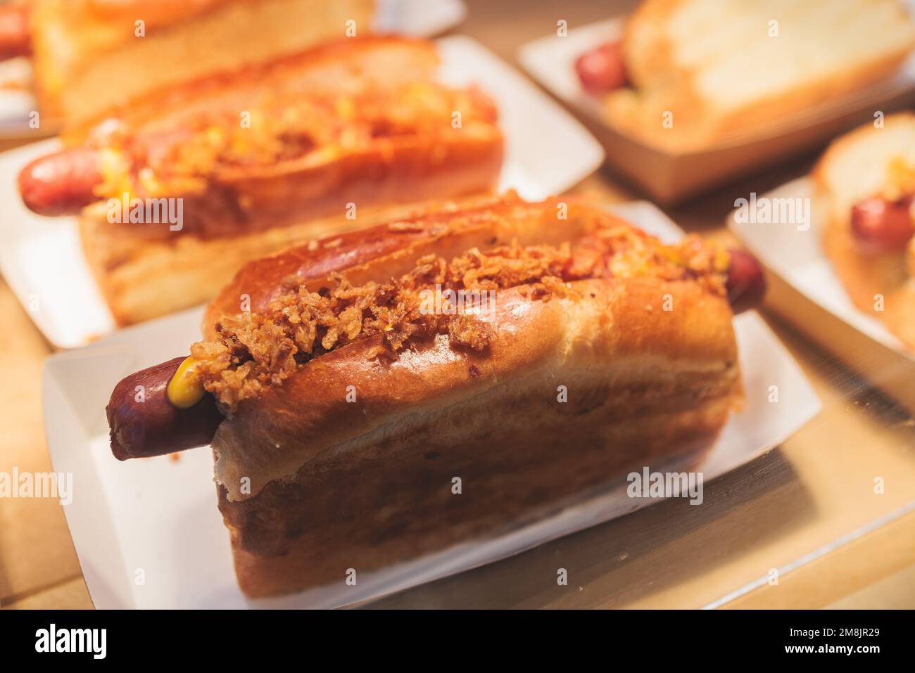 Hot dogs snacks on a table, variety of different hot dog with a sausage ...