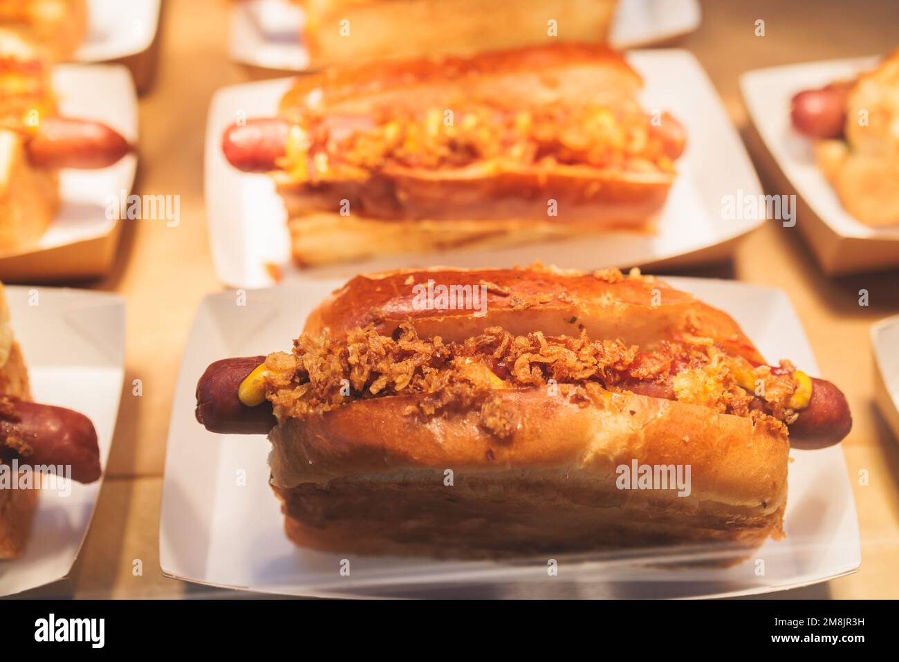 Hot dogs snacks on a table, variety of different hot dog with a sausage ...