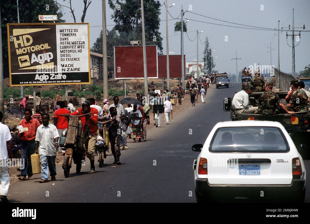 Refugees line the road leading back to Rwanda. Subject Operation/Series ...