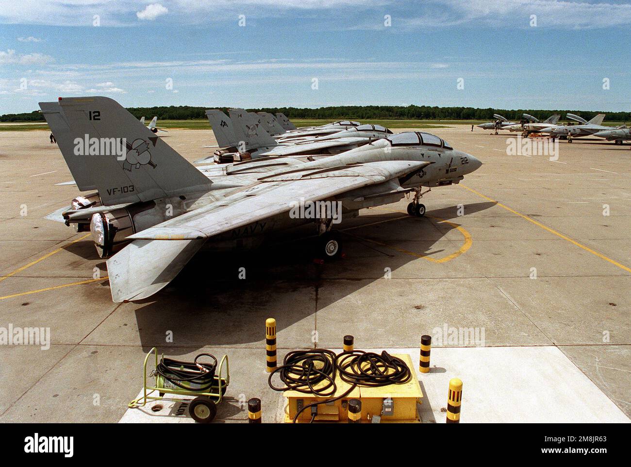 F-14B Tomcat aircraft of Fighter Squadron 103 (VF-103) parked on the flight line outside hangar ...