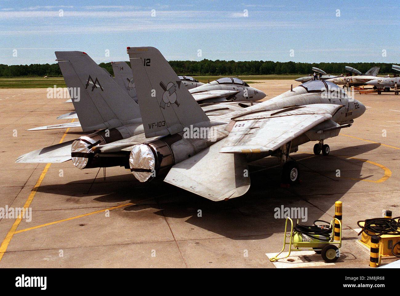 F-14B Tomcat aircraft of Fighter Squadron 103 (VF-103) parked on the flight line outside hangar ...