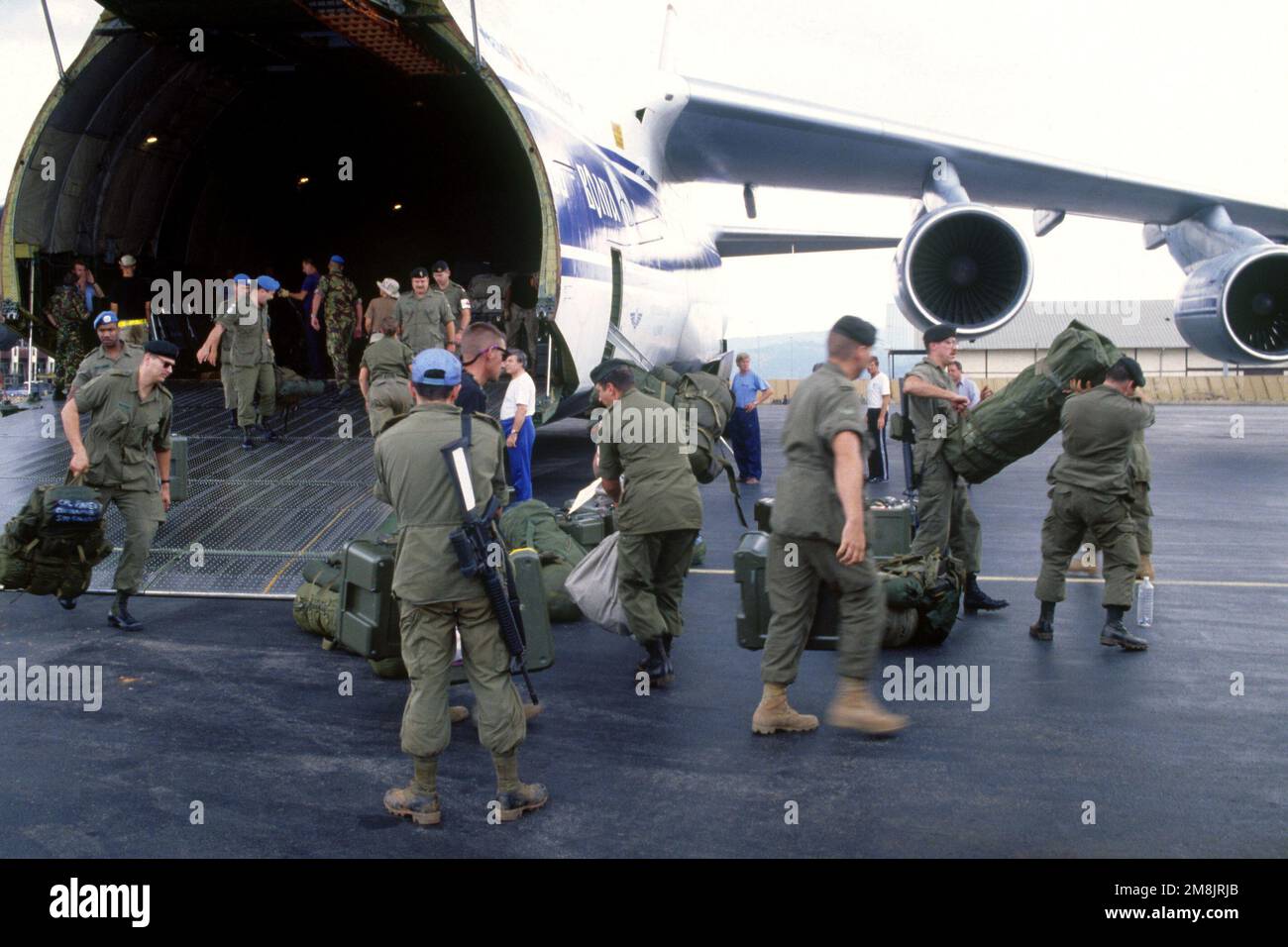 British Air Force personnel from Lyneham, Great Britain off load troops ...