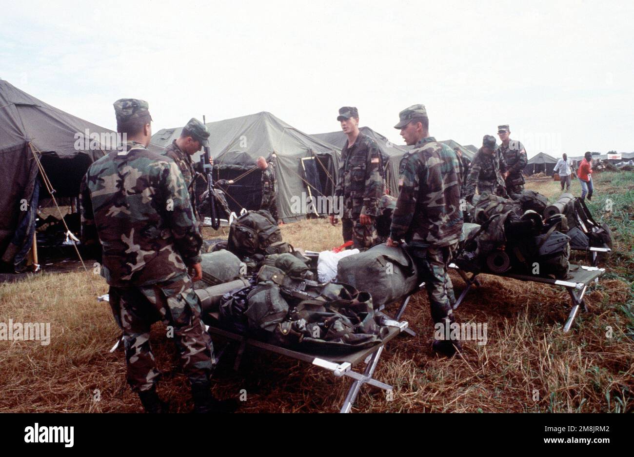 U.S. Army personnel take up residence in the tent city during the ...
