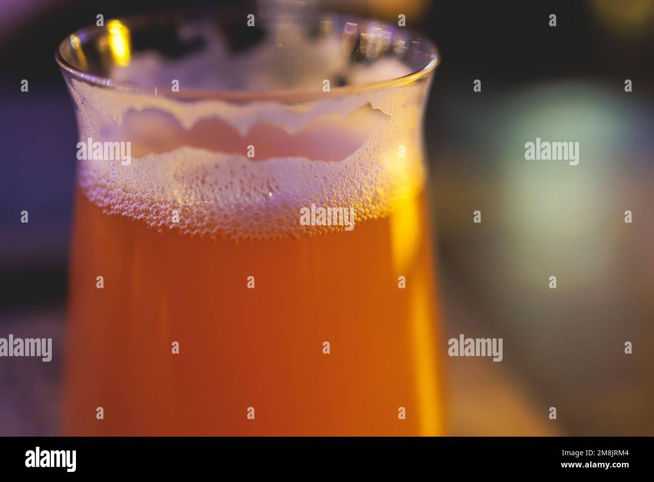 Gold coloured beer glass, view of beer festival, beer assortment in a ...