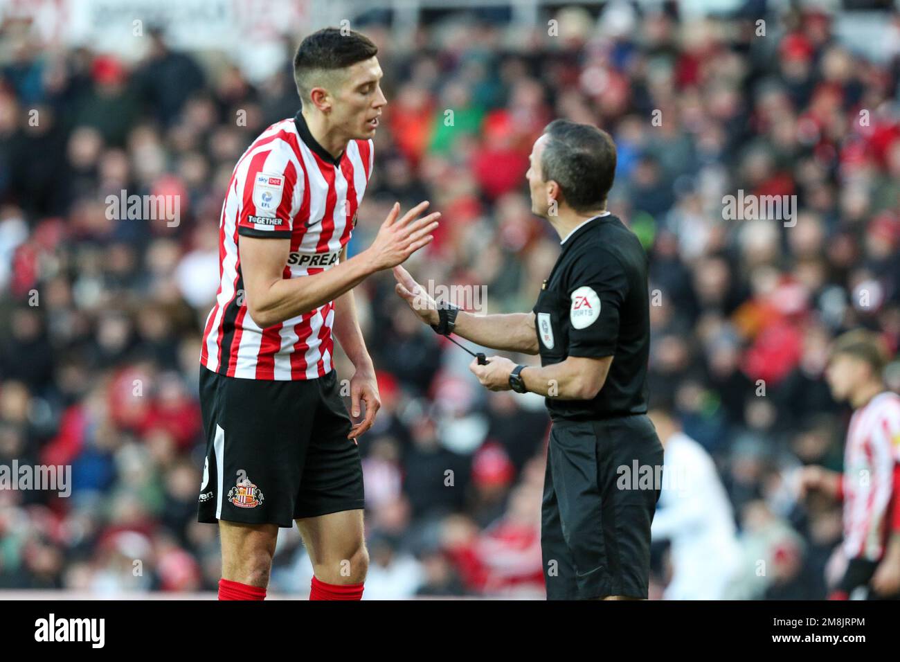 Ross Stewart #14 of Sunderland talks with referee Keith Stroud during ...