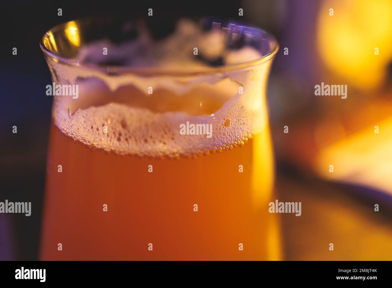 Gold coloured beer glass, view of beer festival, beer assortment in a ...