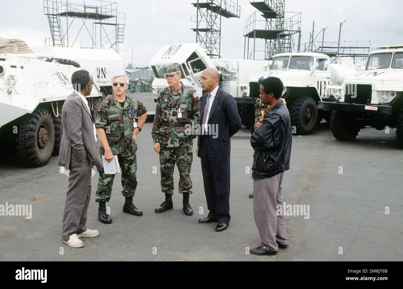 Standing amid United Nation's vehicles are, (2nd from left) LTC Wayne ...