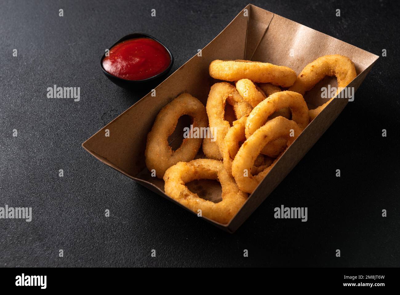 Onion rings in a paper box. The concept of food delivery Stock Photo ...