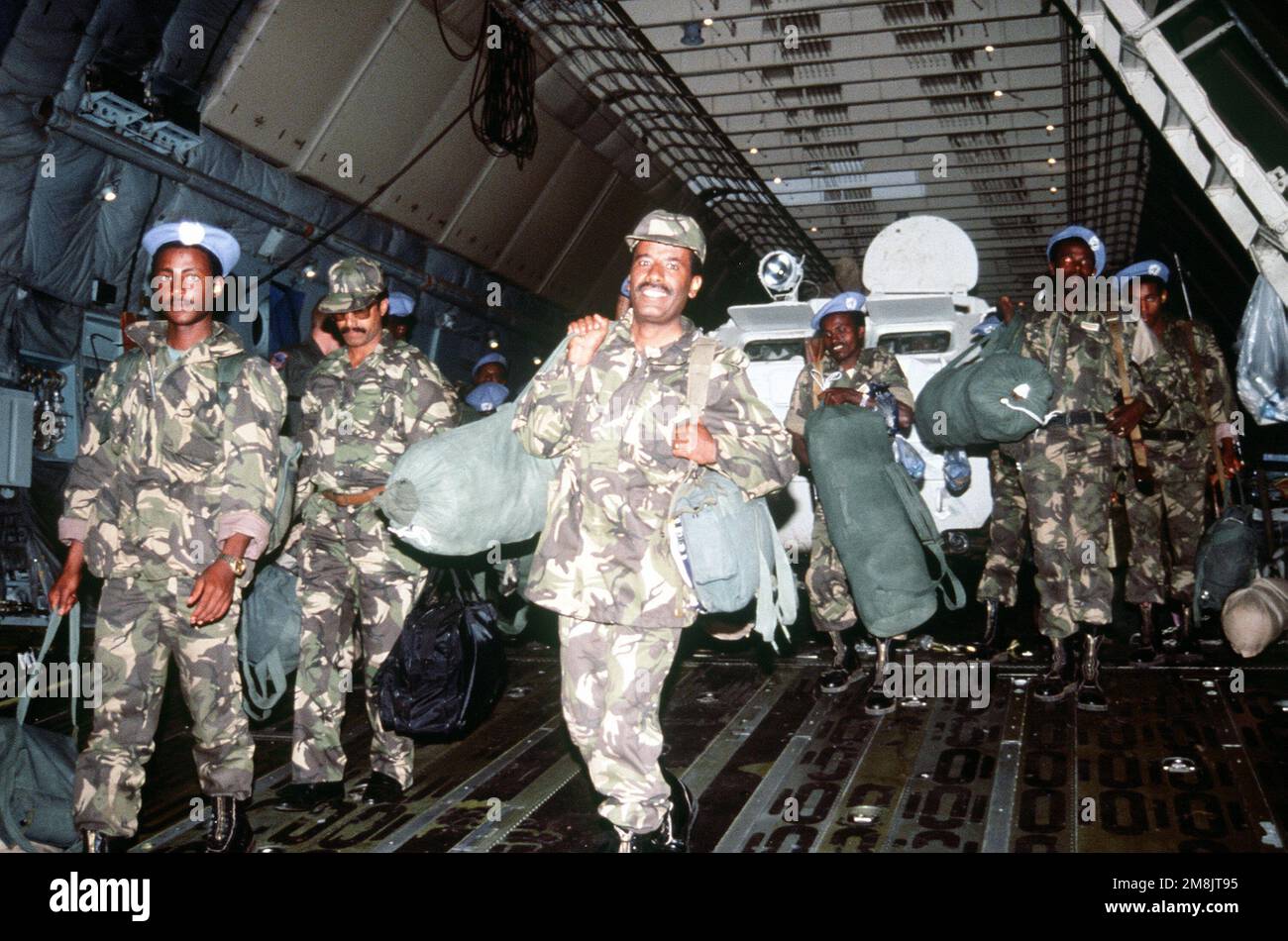 Ethiopian United Nations (UN) troops and weapons are uploaded onto a C ...