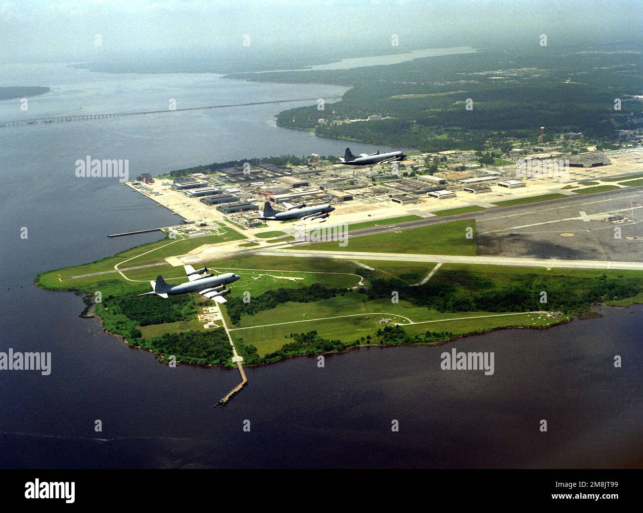 An aerial southern view of three P-3C Orion aircraft of Patrol Squadron ...