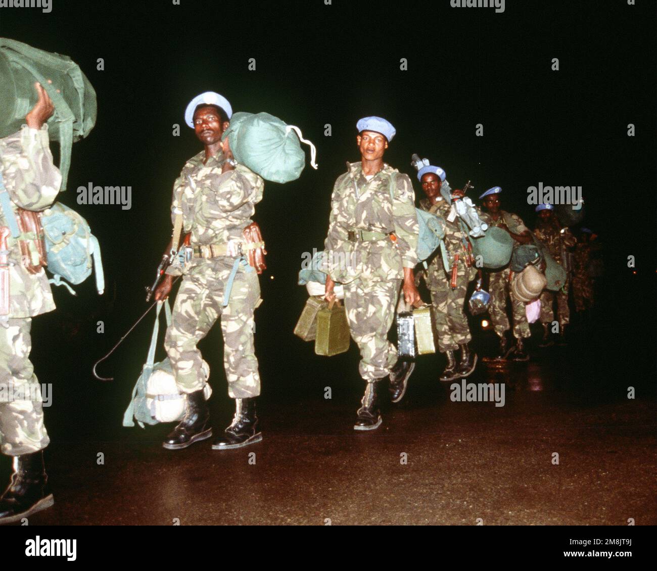 Ethiopian United Nations (UN) troops and weapons are uploaded onto a C ...